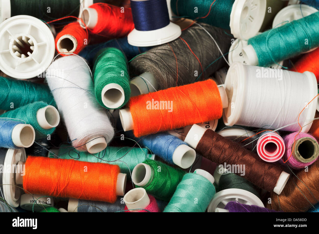 background from many spools of thread Stock Photo - Alamy