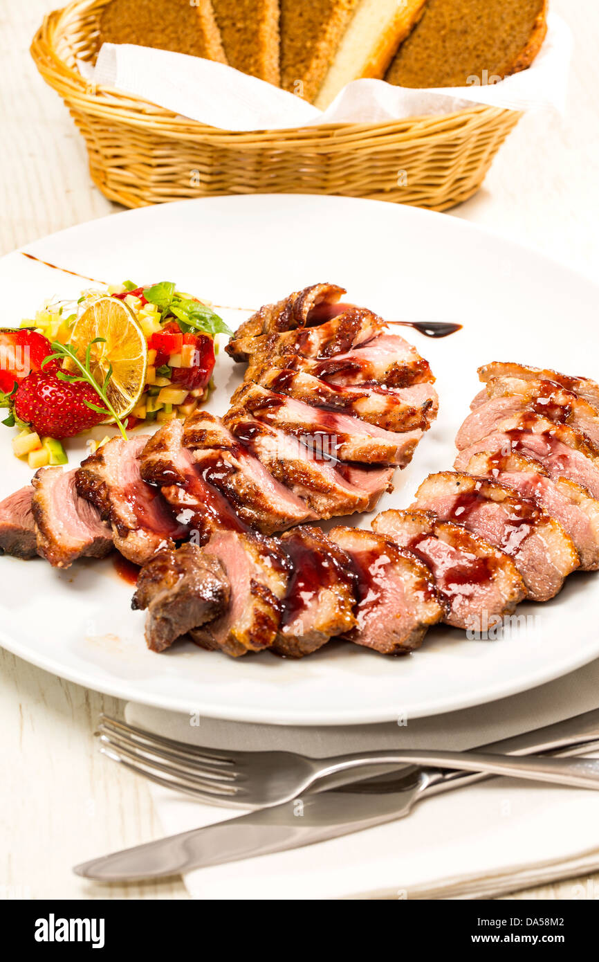 roasted meat on the table in a restaurant Stock Photo - Alamy