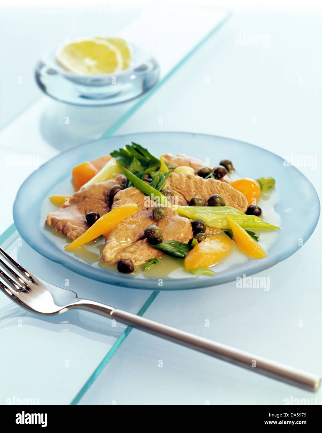 Poached veal scallops with capers, shallots and carrots Stock Photo - Alamy