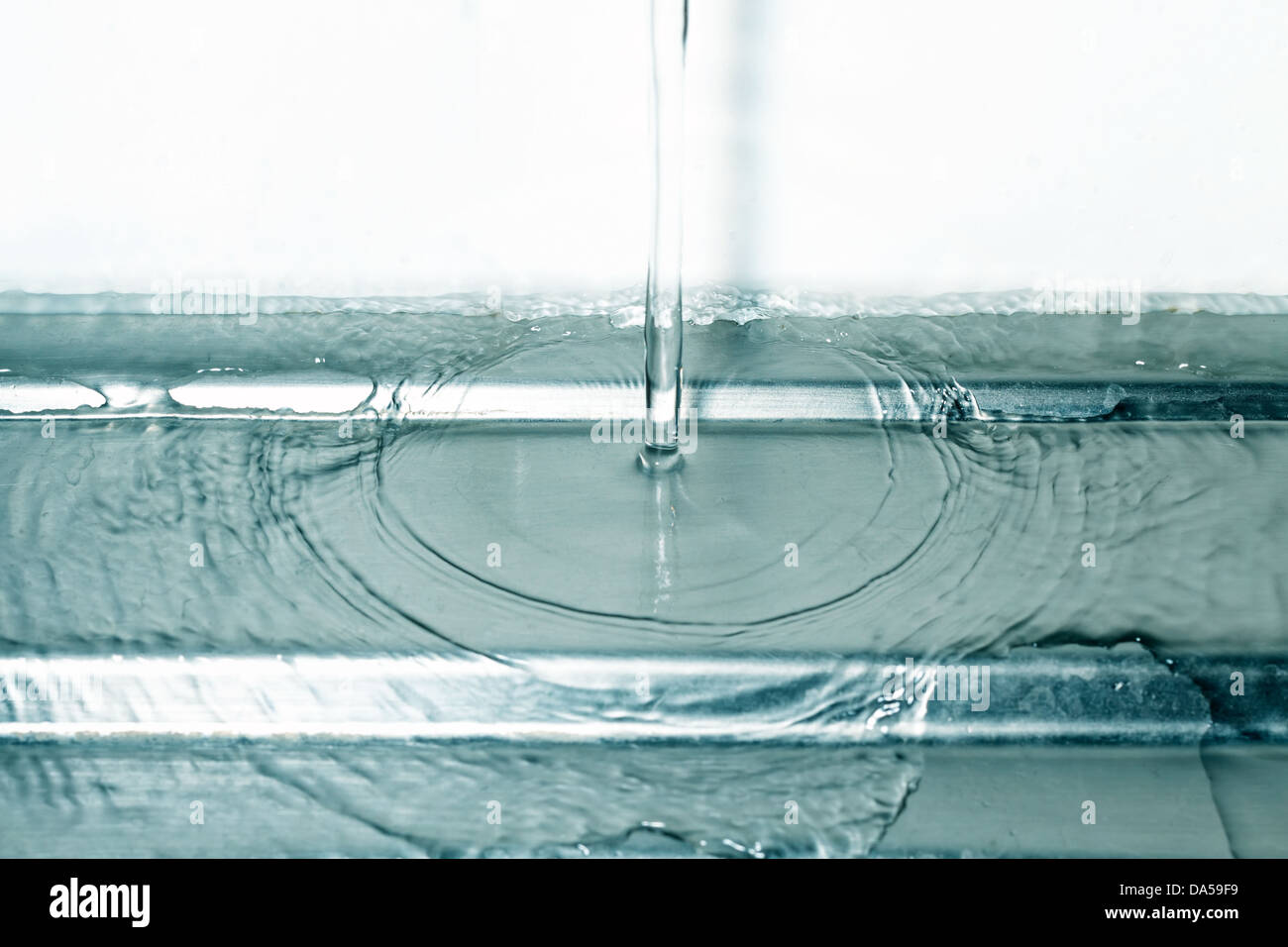 Water splashing on metal surface Stock Photo - Alamy