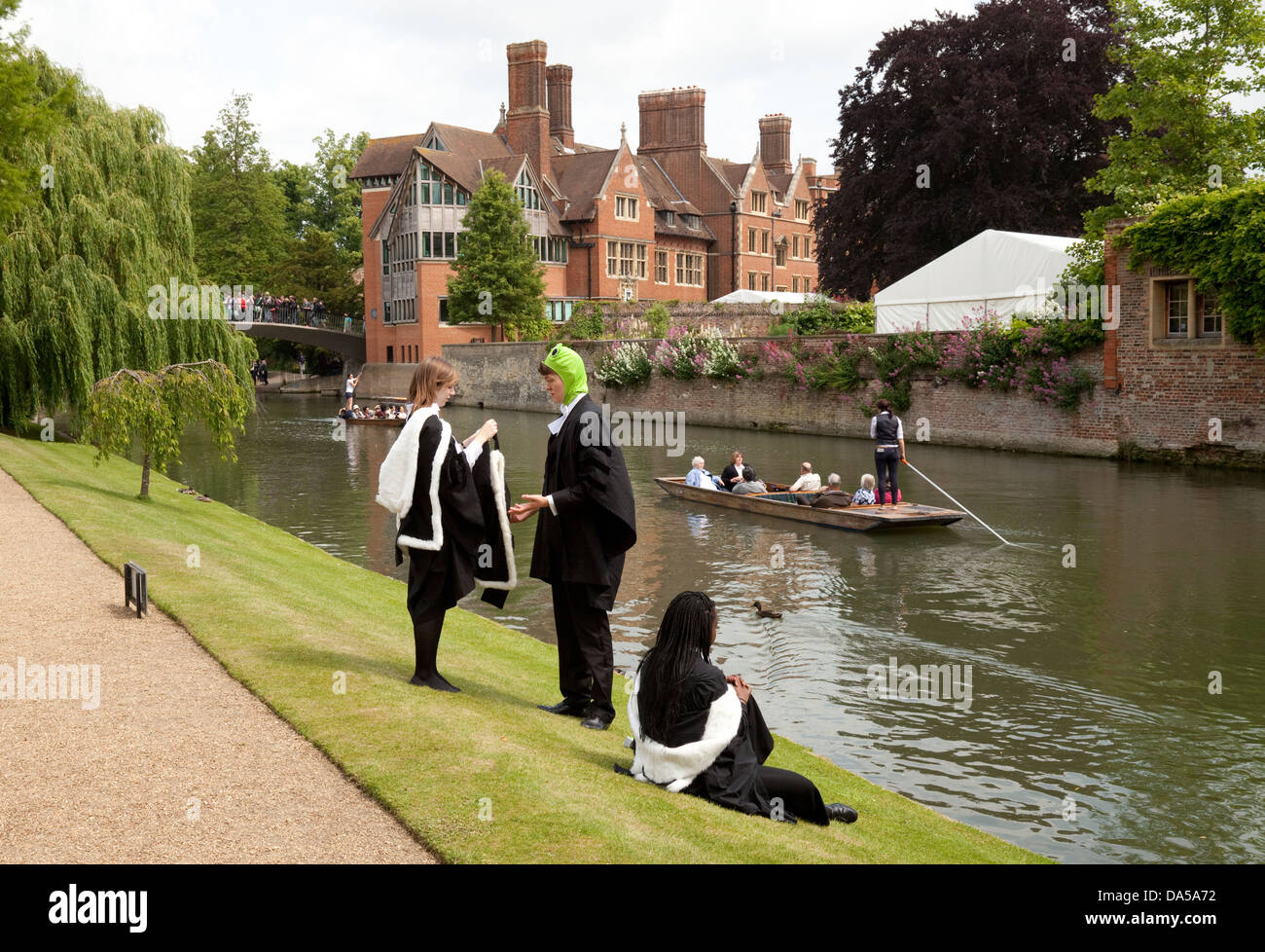 Graduates on the banks of the River Cam on Graduation Day, Cambridge ...