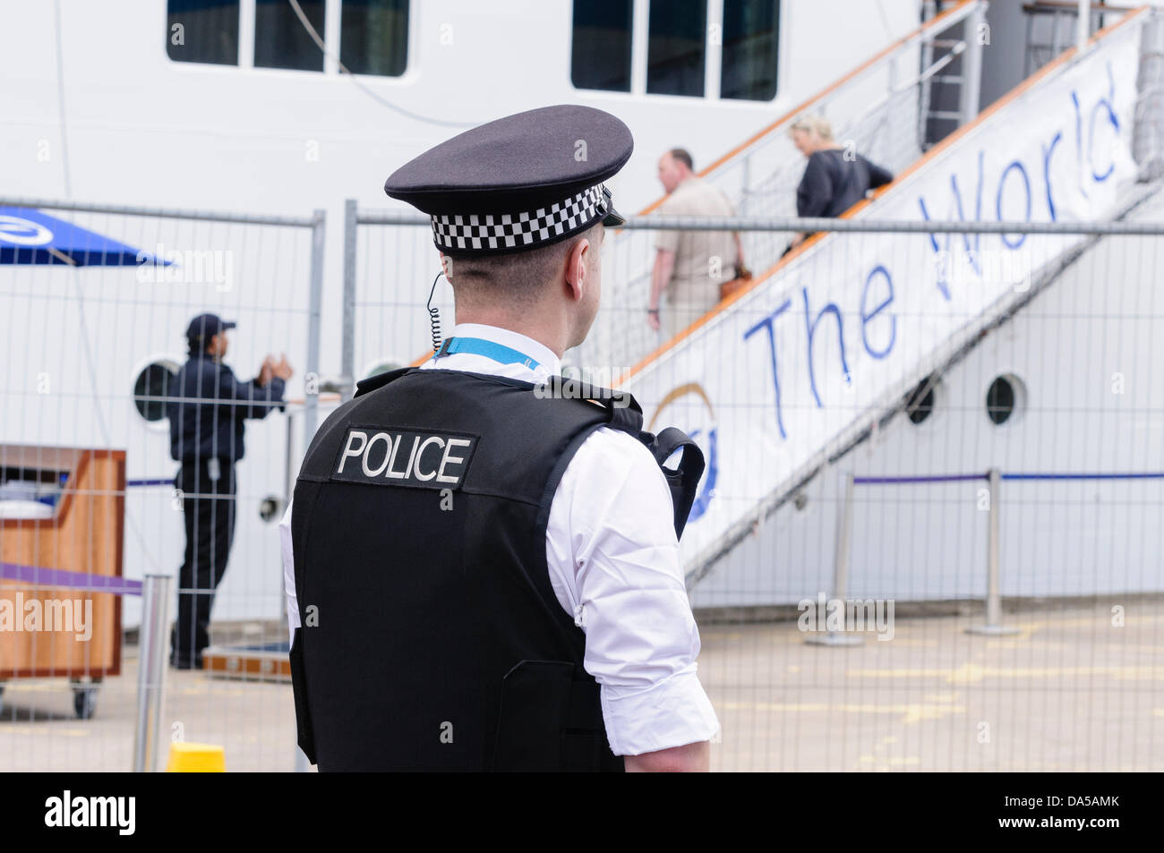 Belfast, Northern Ireland. 4th July 2013. A police officer looks on as ...