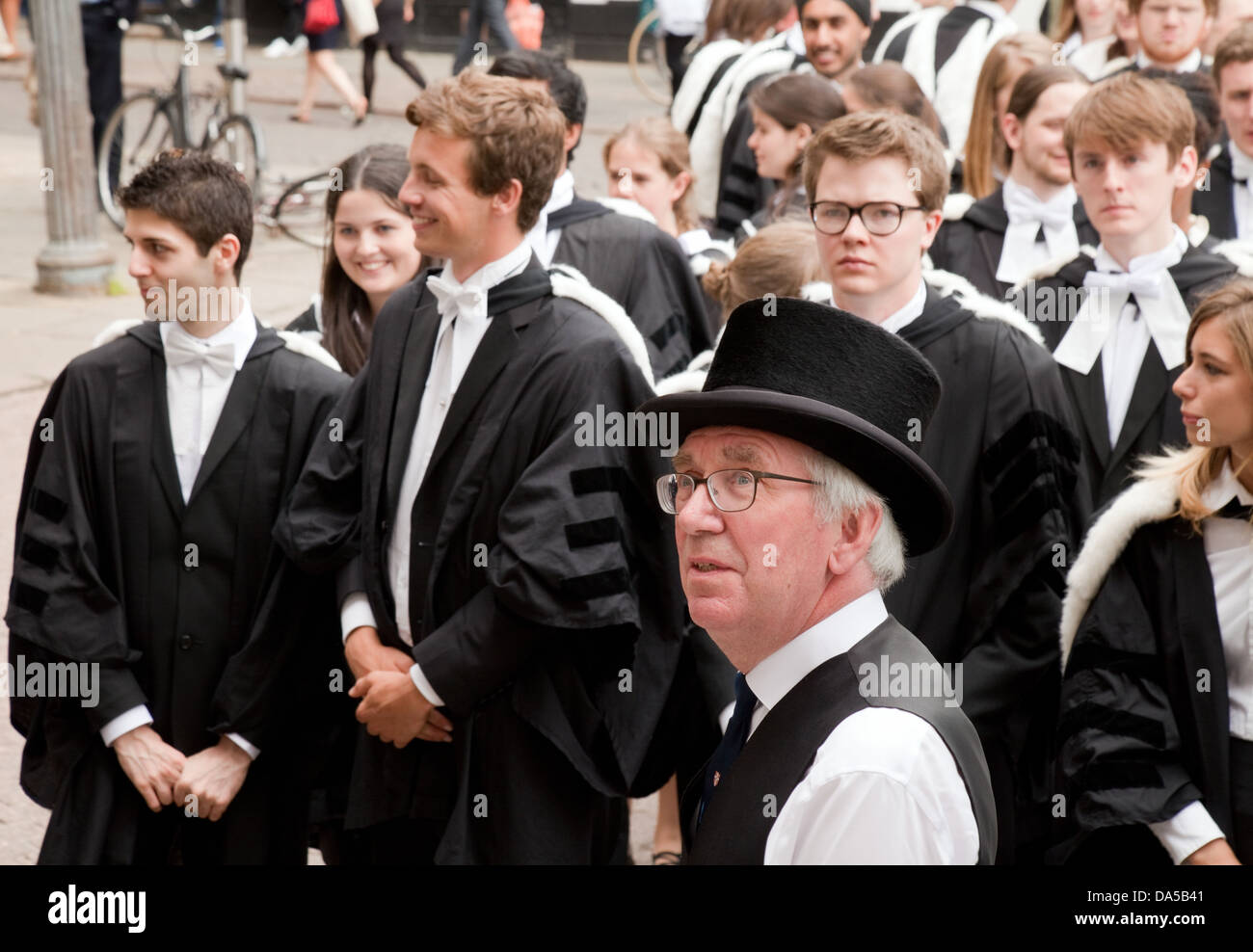 Graduation ceremony - A university porter marshalling the graduating ...