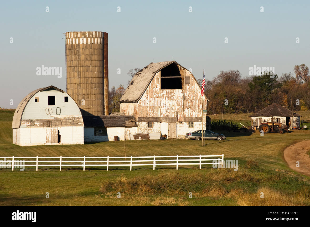 Farmyard and barn. Connected double barn with silo Stock Photo - Alamy