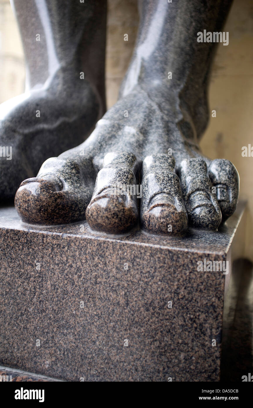 Close up of foot of a large sculpture of a Roman figure holding up a ...