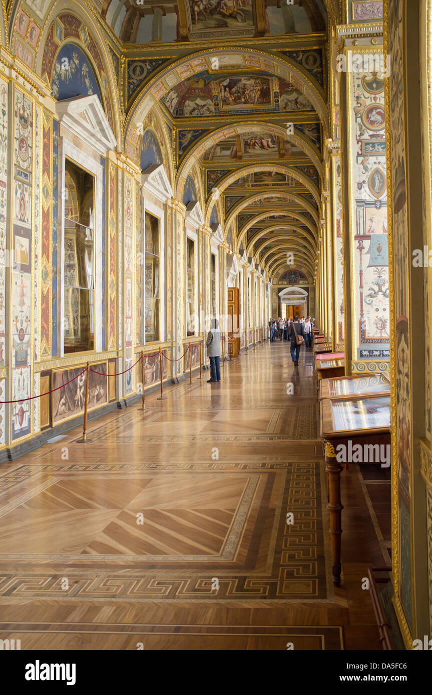 Long corridor ornately decorated in the State Hermitage museum, a ...