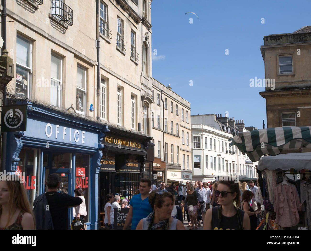 Shops and shoppers in Burton Street, Bath, Somerset, England Stock ...