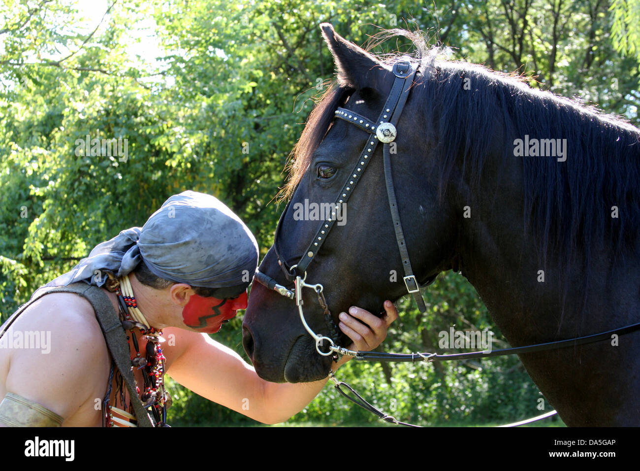 Native American Indian man bonding with a horse Stock Photo - Alamy