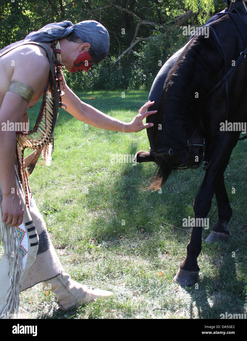 A Native American Indian man with a horse bowing to him Stock Photo - Alamy