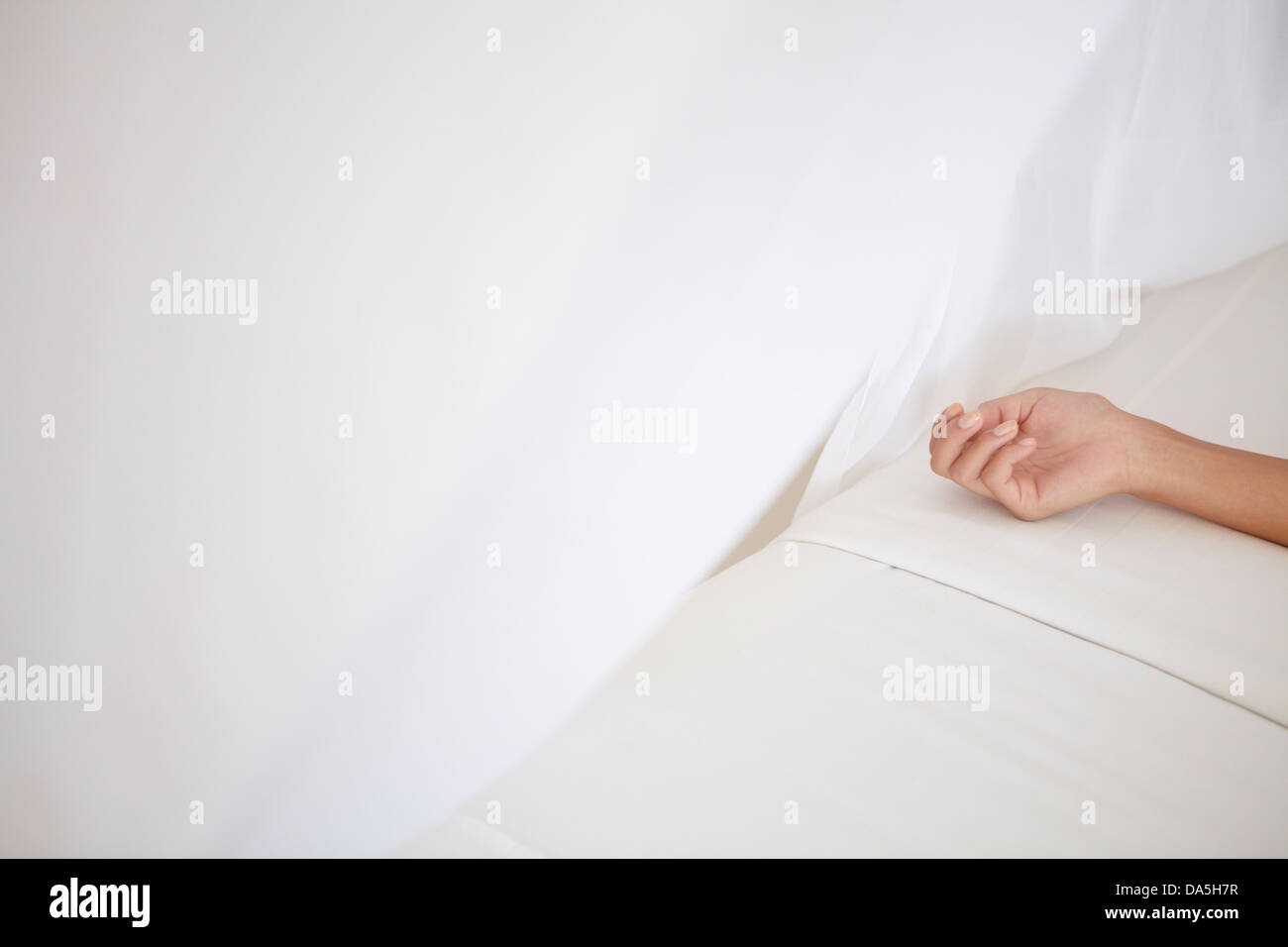 CLose up of a hand on a bed Stock Photo - Alamy