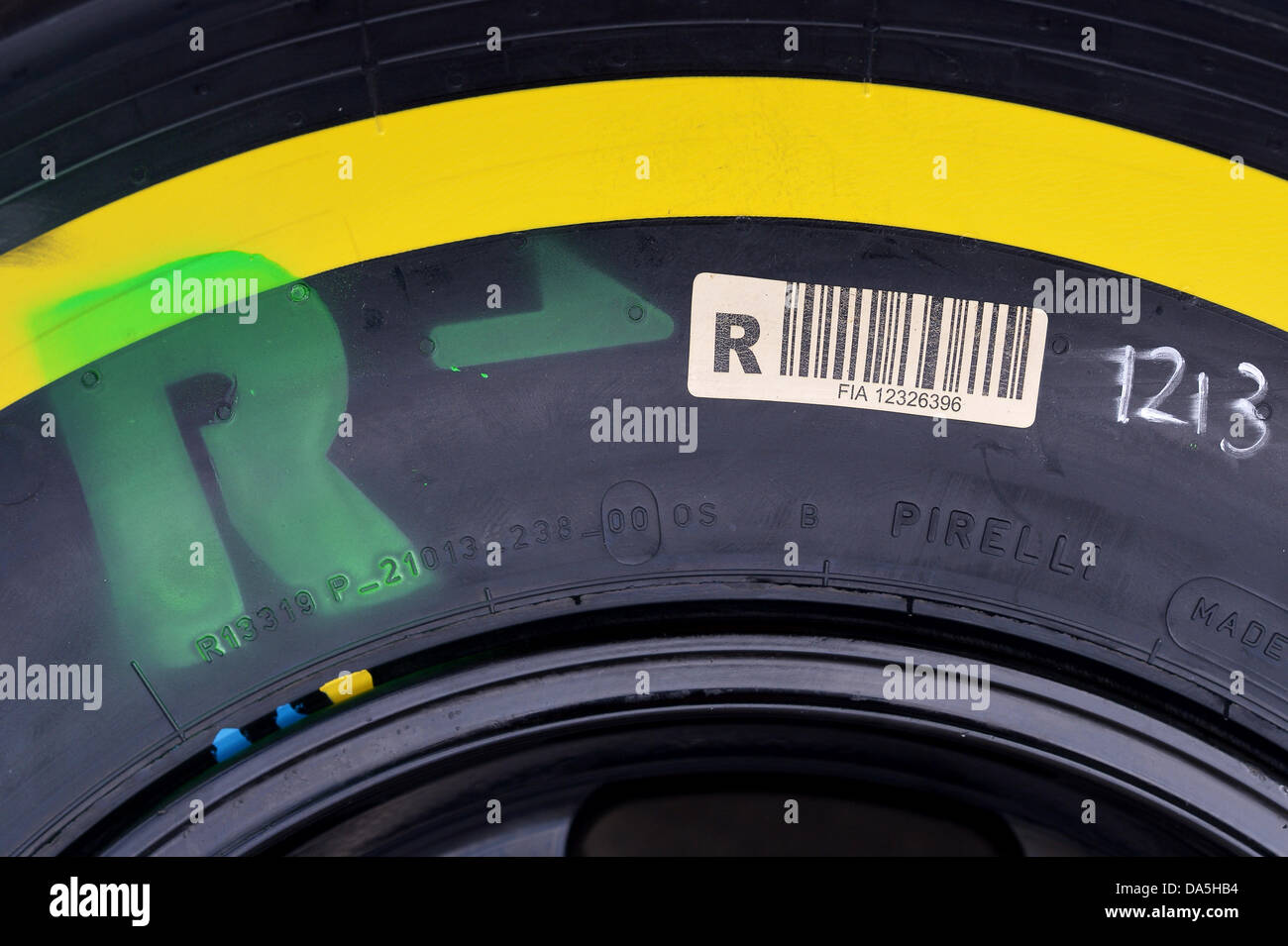 A slick tyre marked with an 'R' for right by Pirelli (on the barcode ...