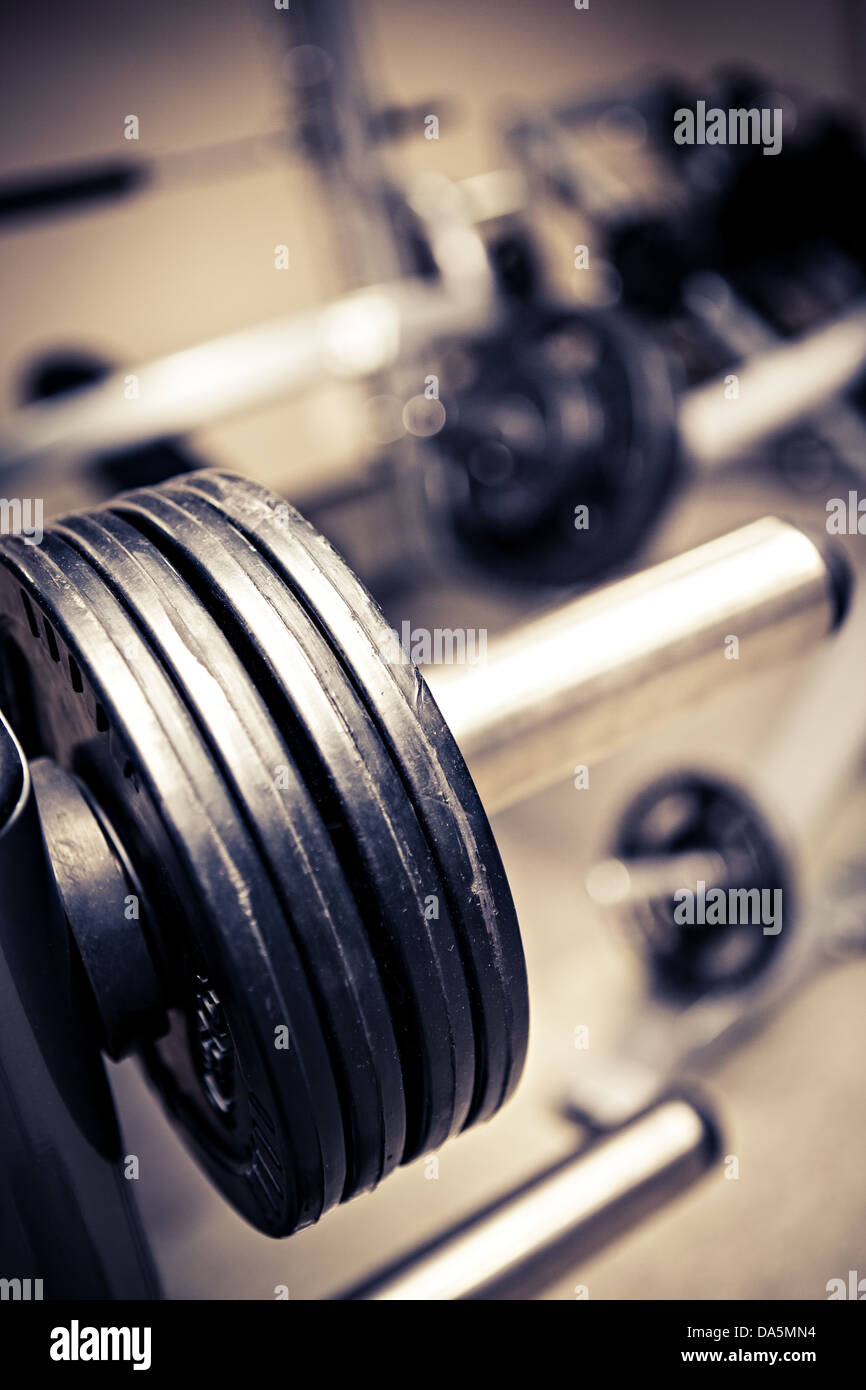 diverse equipment and machines at the gym room Stock Photo - Alamy
