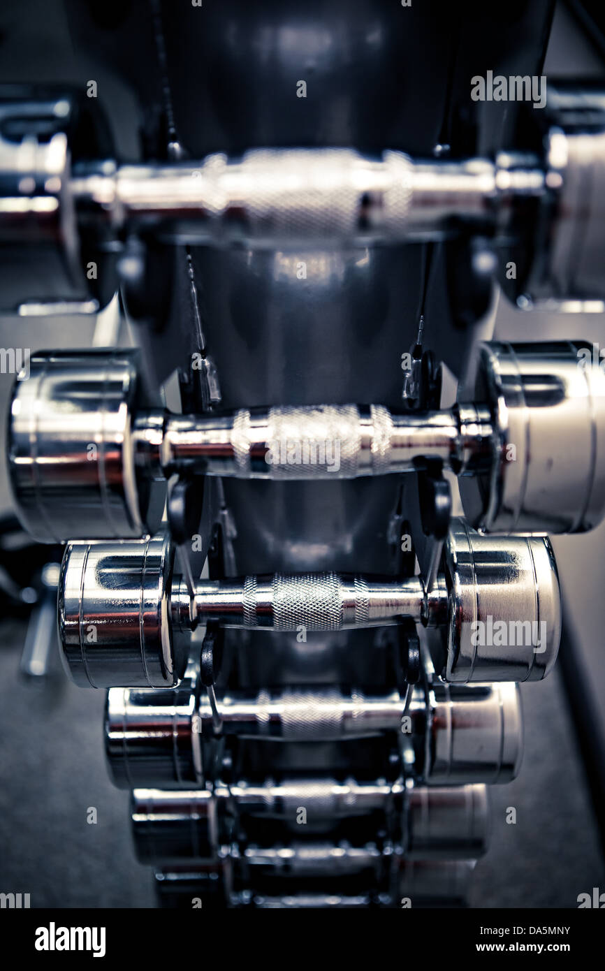 diverse equipment and machines at the gym room Stock Photo - Alamy