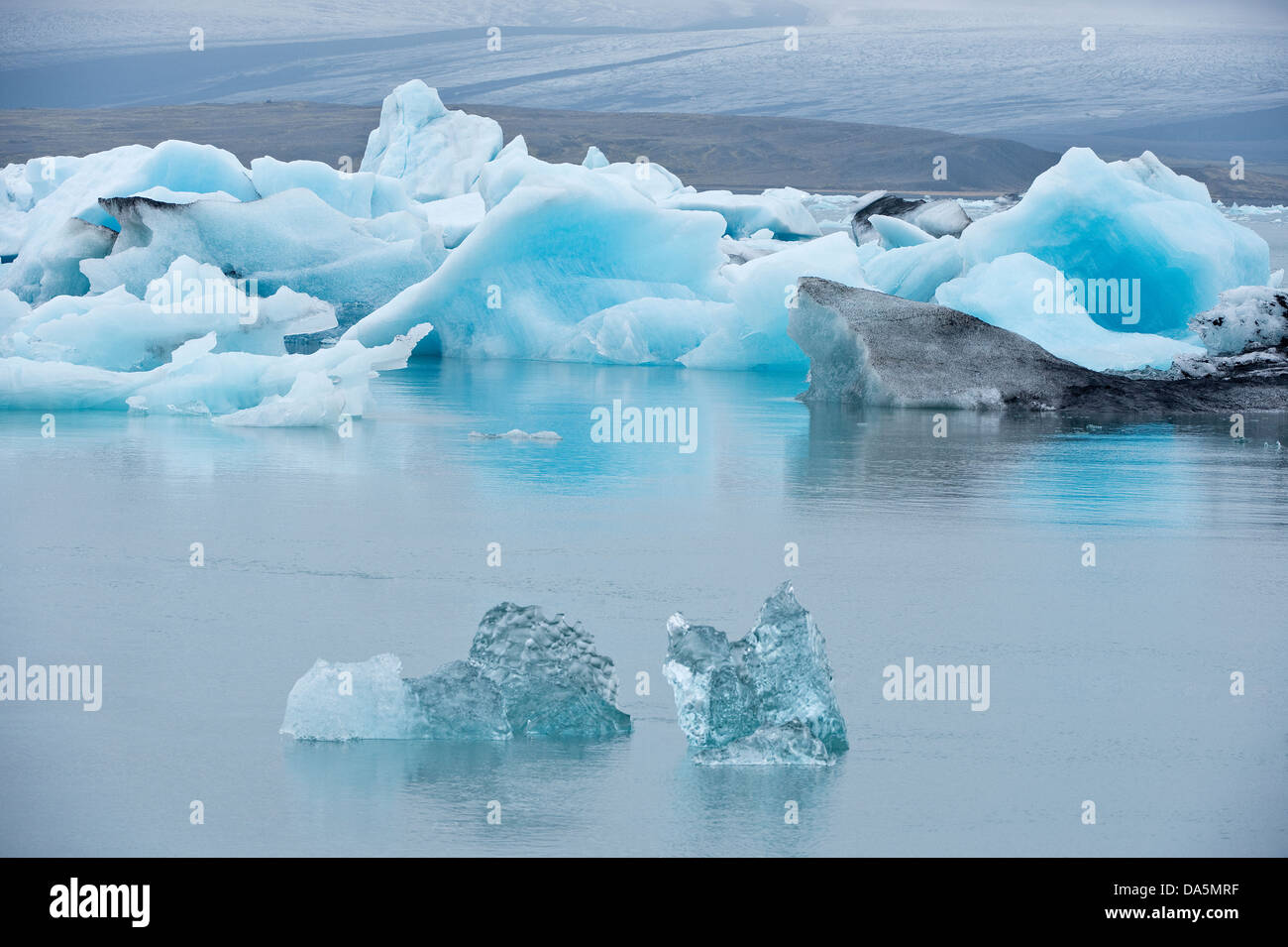 Bright blue icebergs floating in water of Jökulsárlón ("glacial river ...