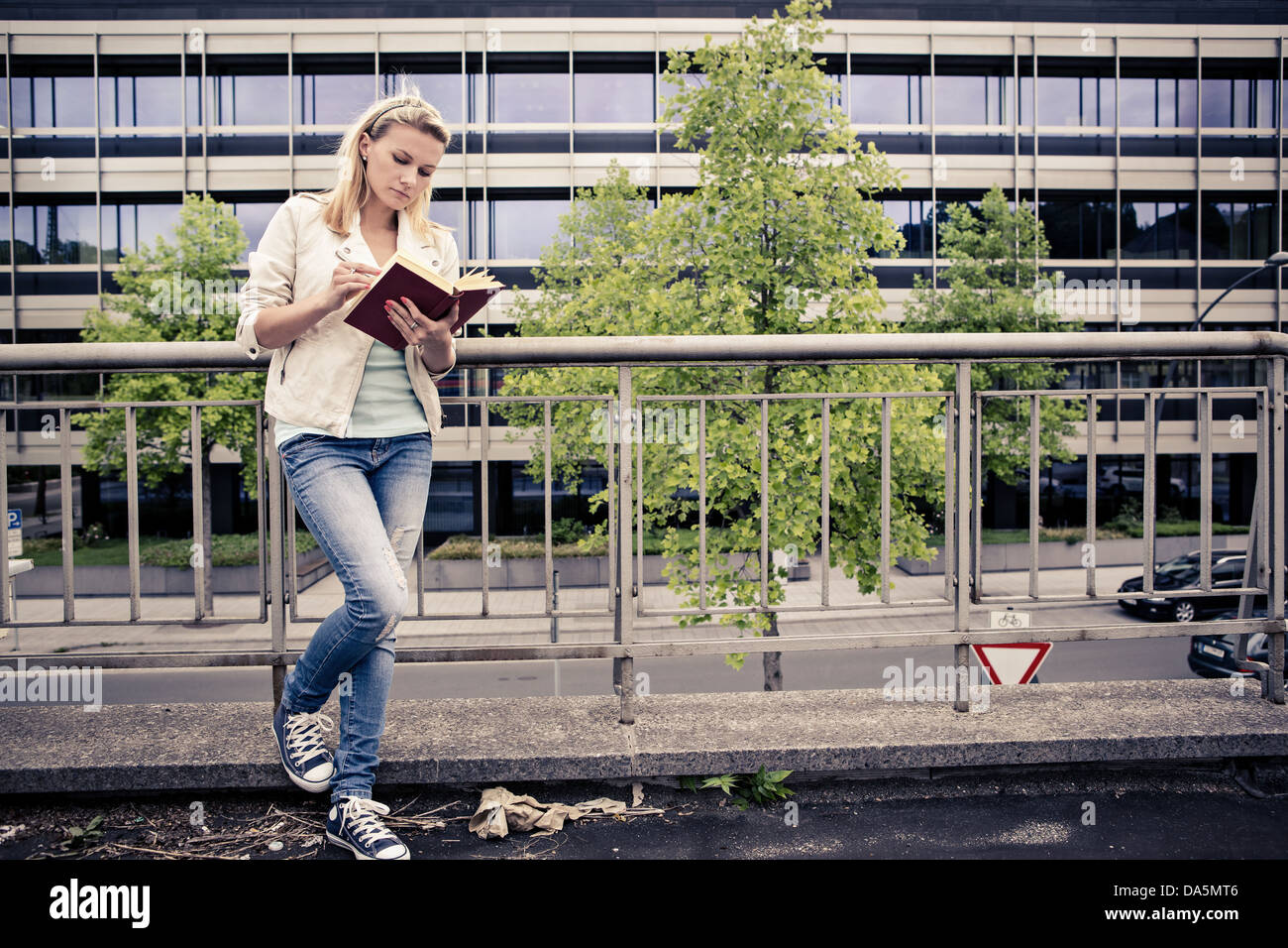 portrait of a young woman in a town Stock Photo - Alamy