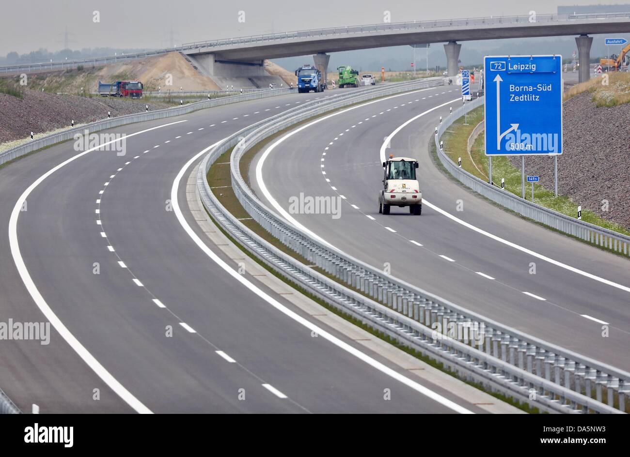 Construction workers complete the last remaining sections of the A72 ...
