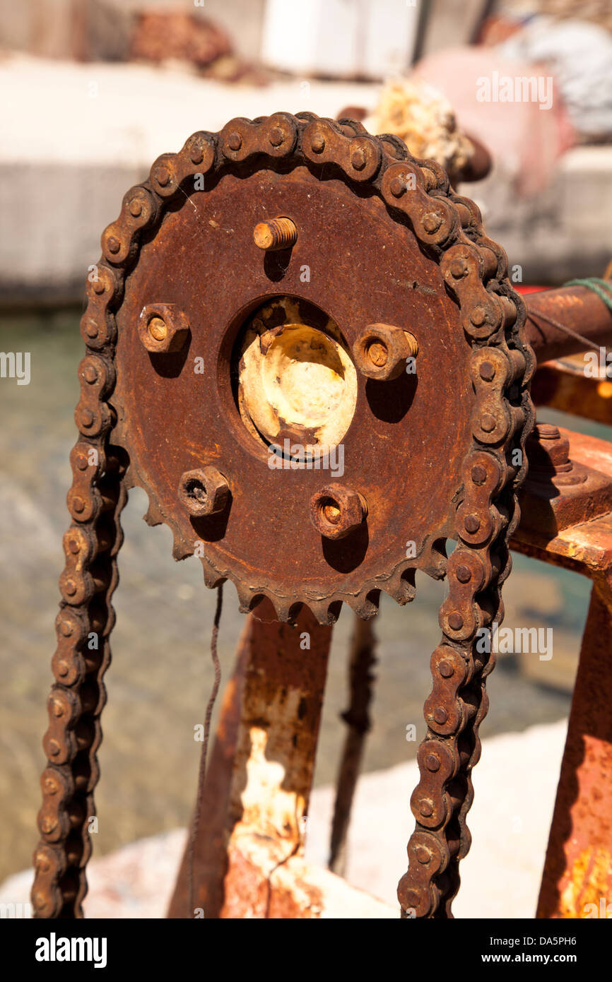 A rusty cog wheel in the harbour Stock Photo - Alamy