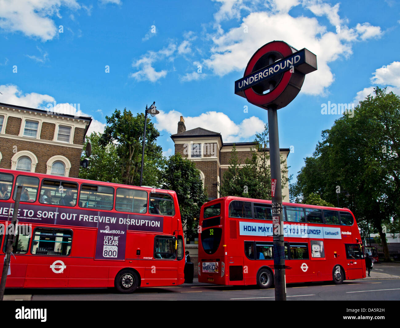 Red Double-decker London buses at Kilburn Park Station showing ...