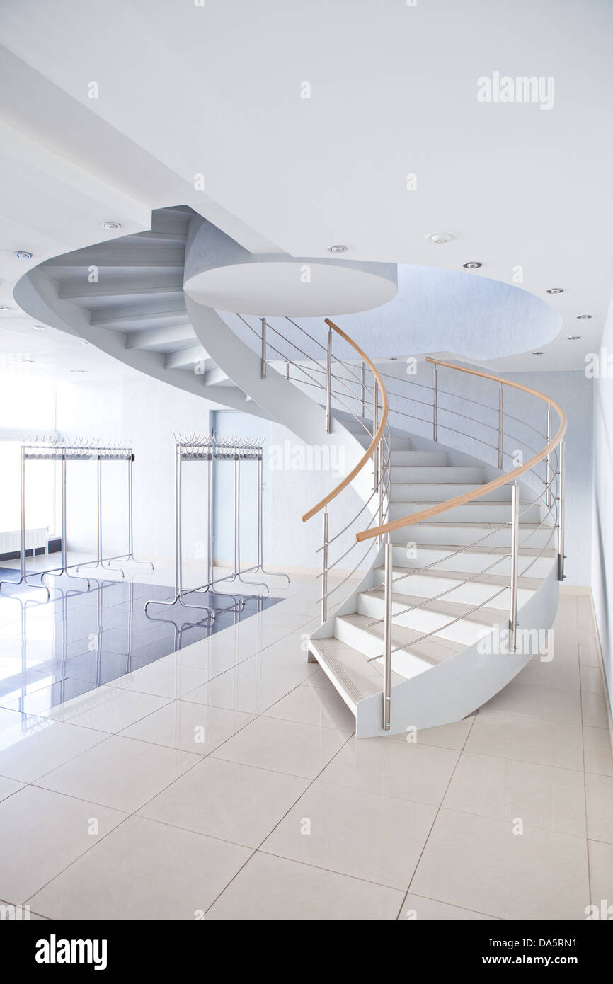 Spiral staircase in office hall Stock Photo - Alamy