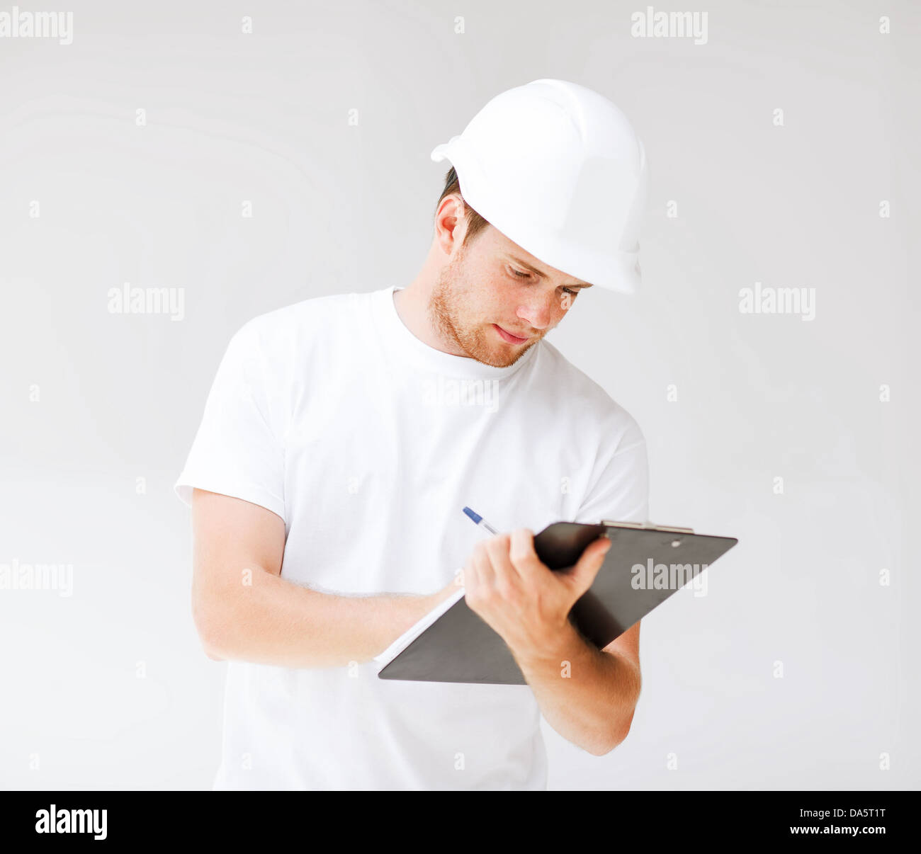 male architect looking at blueprint Stock Photo - Alamy