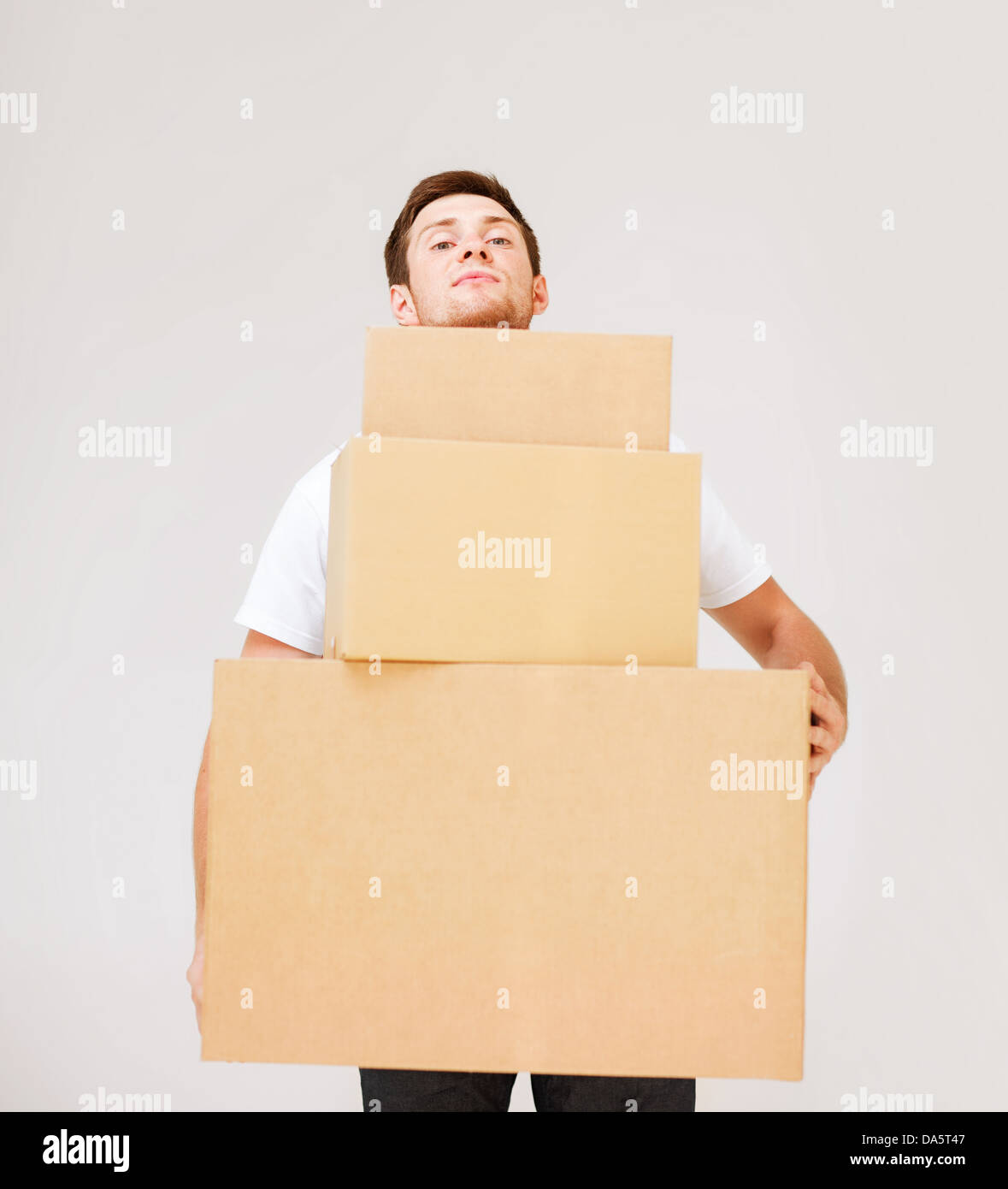 young man carrying carton boxes Stock Photo - Alamy