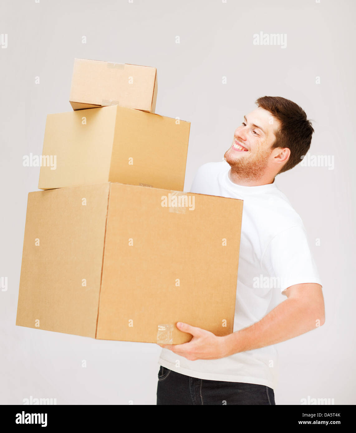 young man carrying carton boxes Stock Photo - Alamy