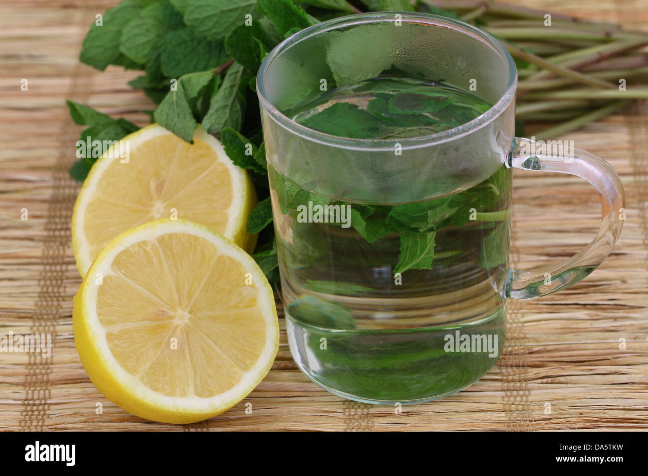 Mint tea and fresh lemon Stock Photo - Alamy