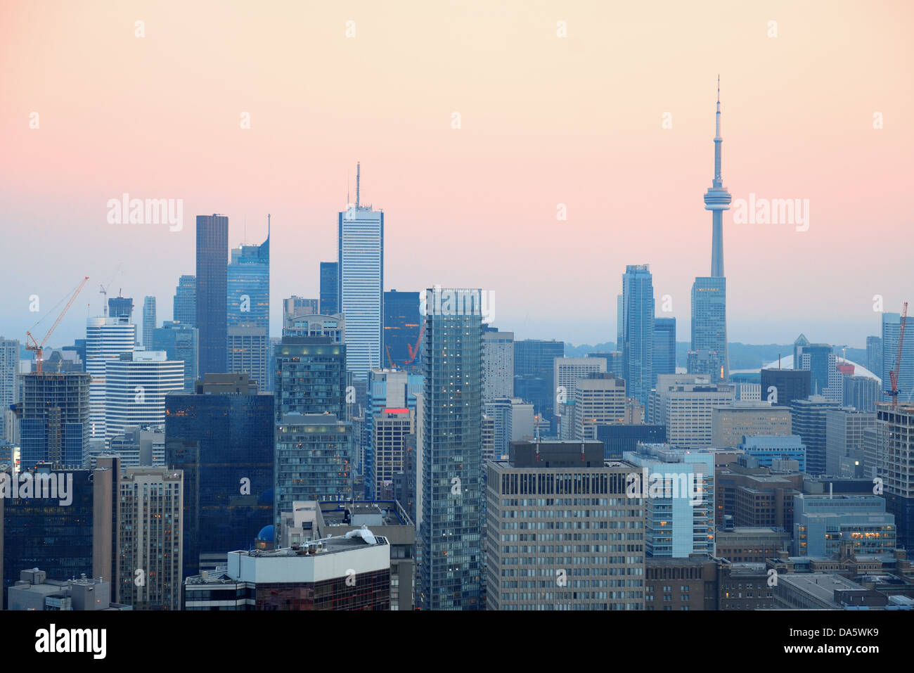 Toronto at dusk with city light and urban skyline with skyscrapers ...