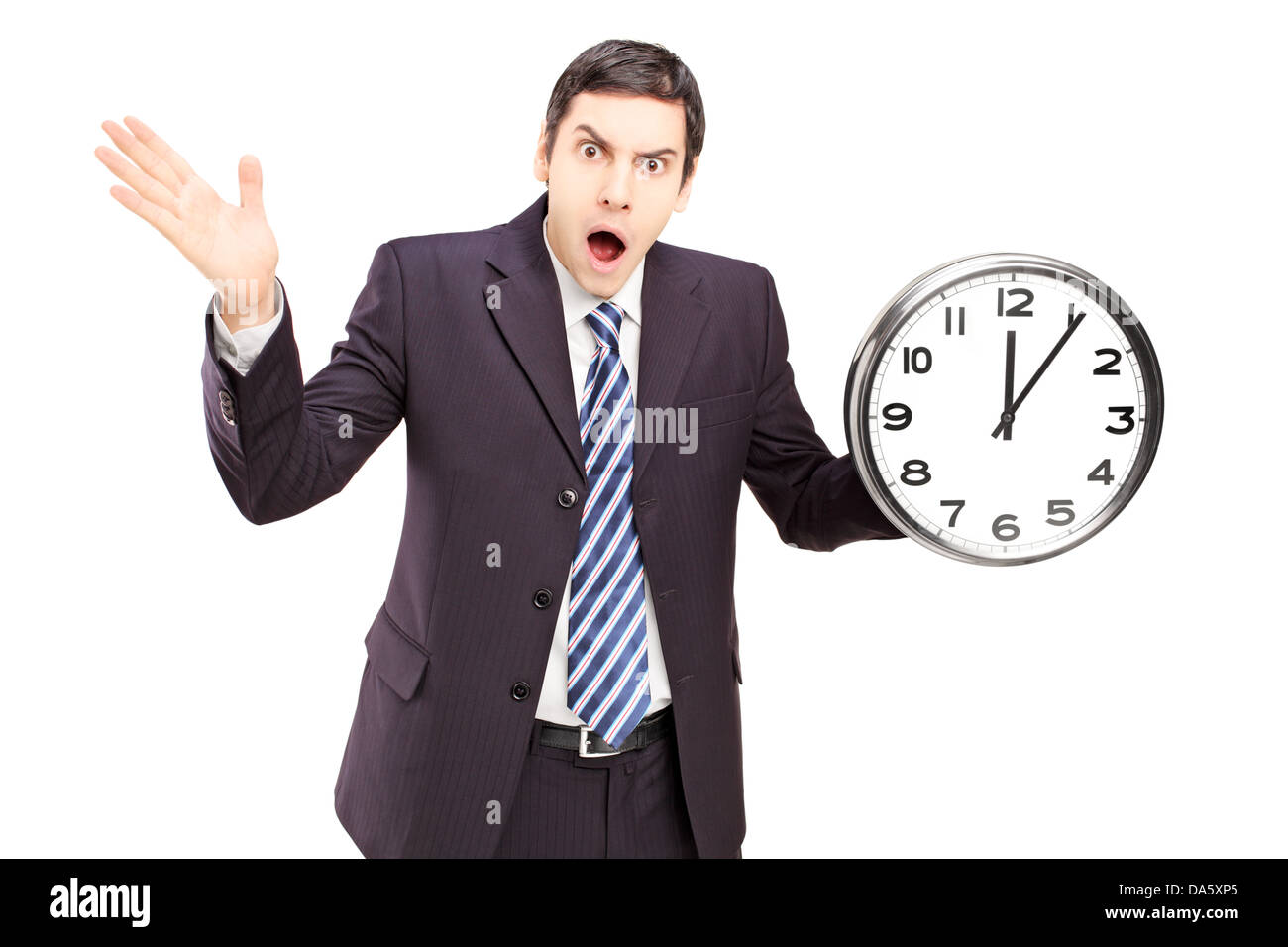 Angry man in a suit holding a clock and gesturing, isolated on white ...