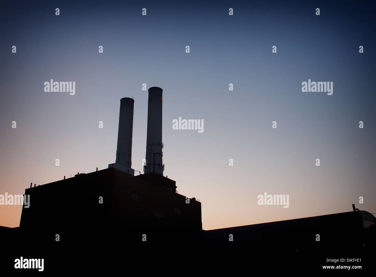 Power plant in silhouette at sunset in Detroit Stock Photo - Alamy