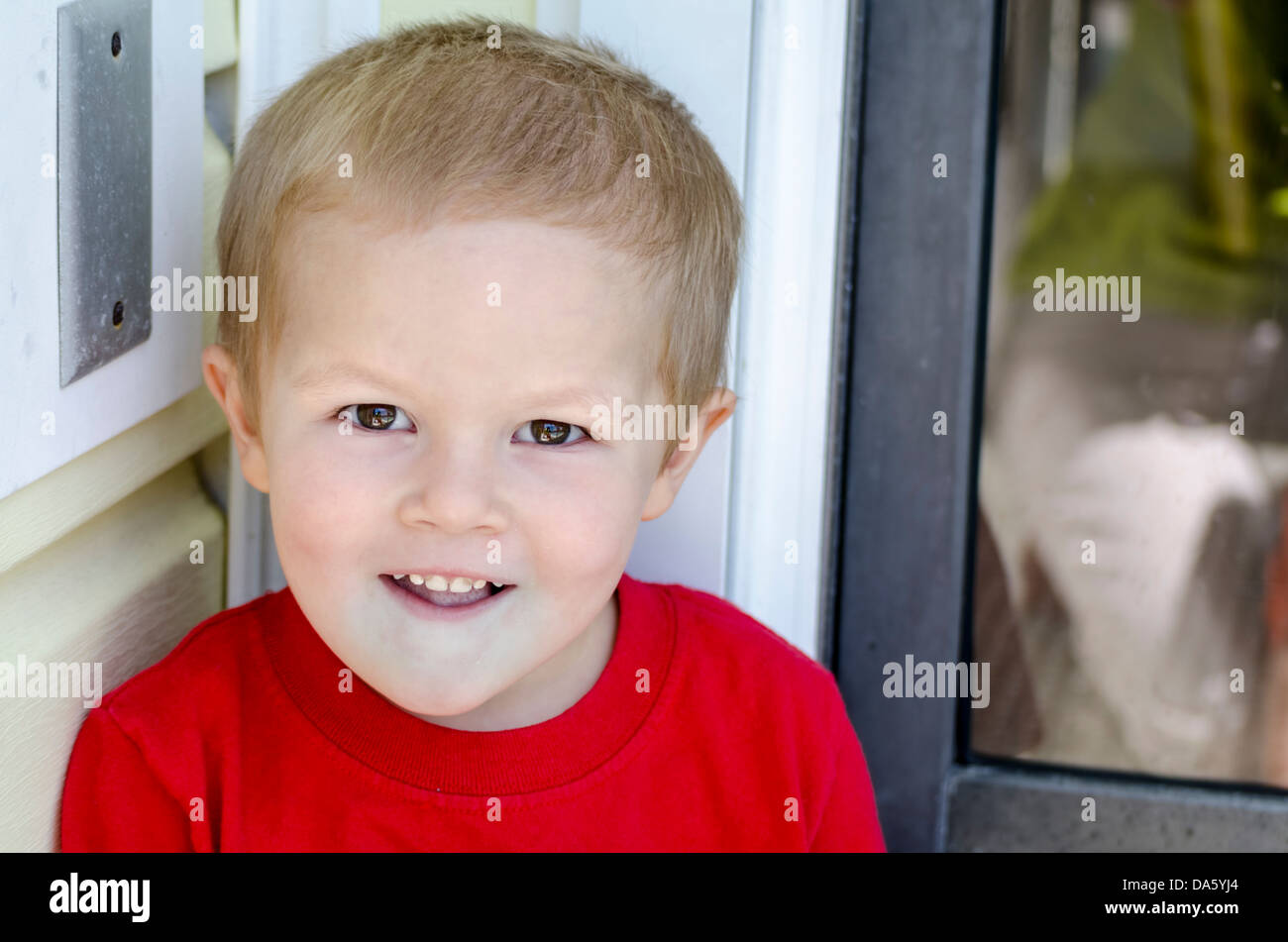 Boy in Red Shirt Stock Photo - Alamy
