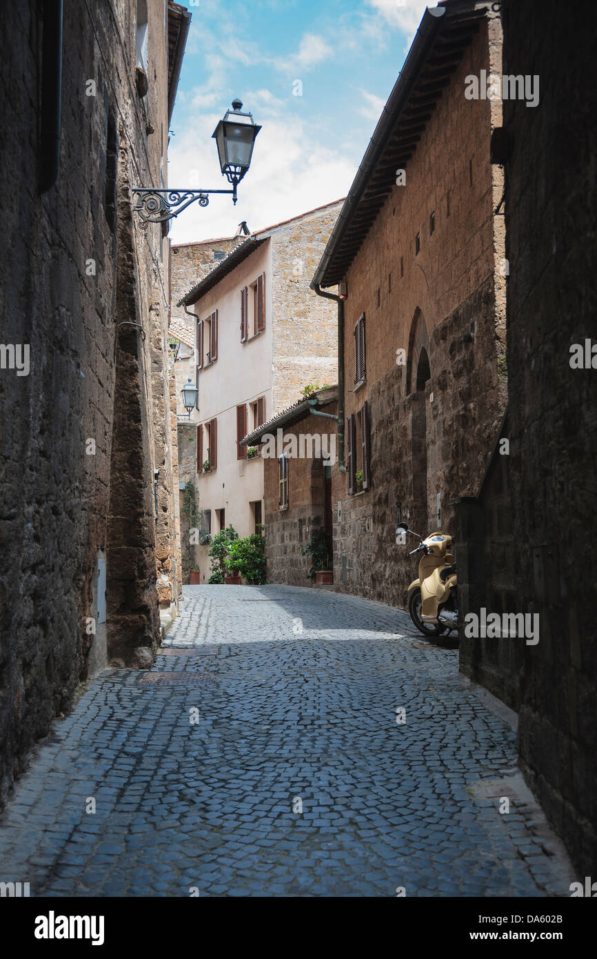 A typical narrow street in the hill town of Orvieto, Italy Stock Photo ...