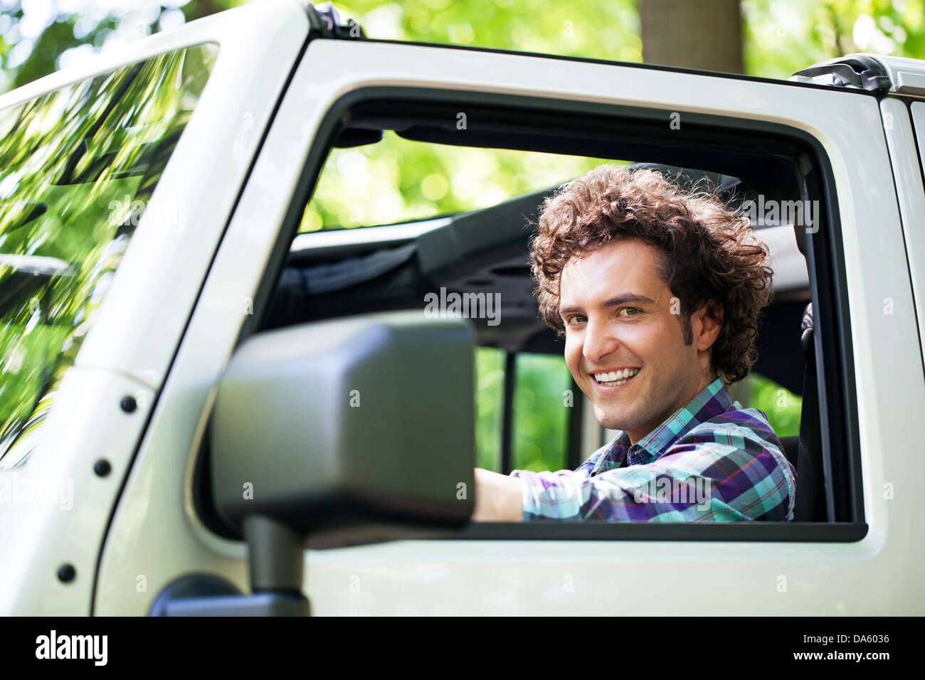 handsome Young Man Driving car Stock Photo - Alamy