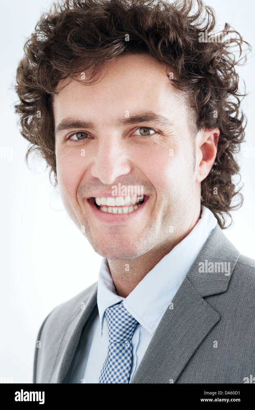 A young smiling businessman, isolated on white Stock Photo - Alamy