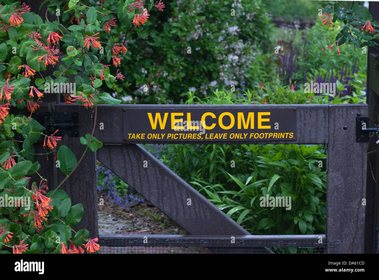 Rainy day at a park, Welcome sign says Take Only Pictures, Leave only ...