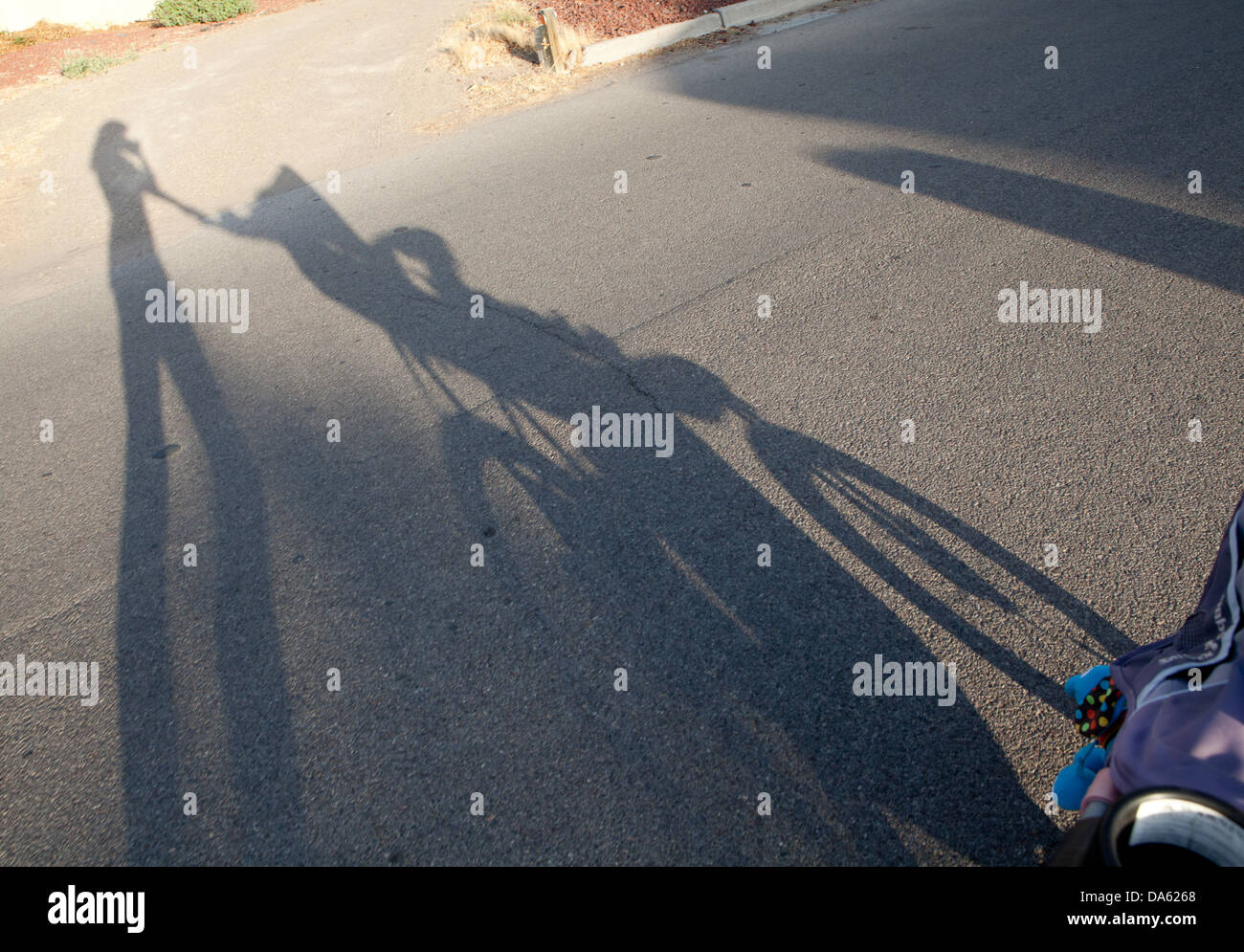 Shadow of a woman pushing a stroller, walking baby Stock Photo - Alamy