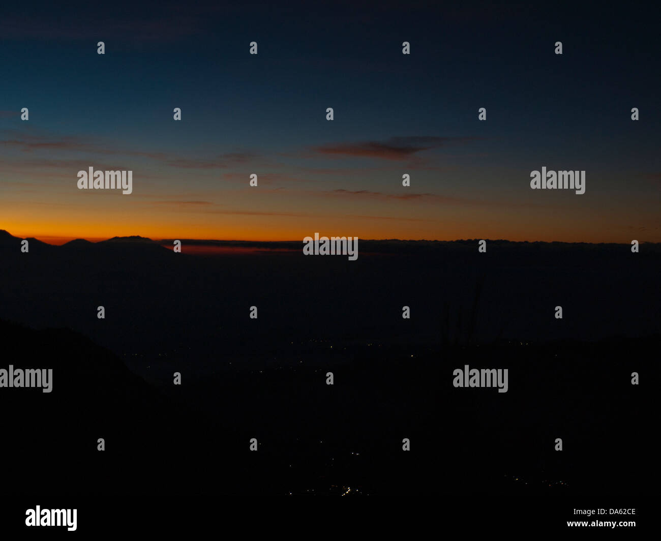 Dawn light behind the mountains Stock Photo - Alamy
