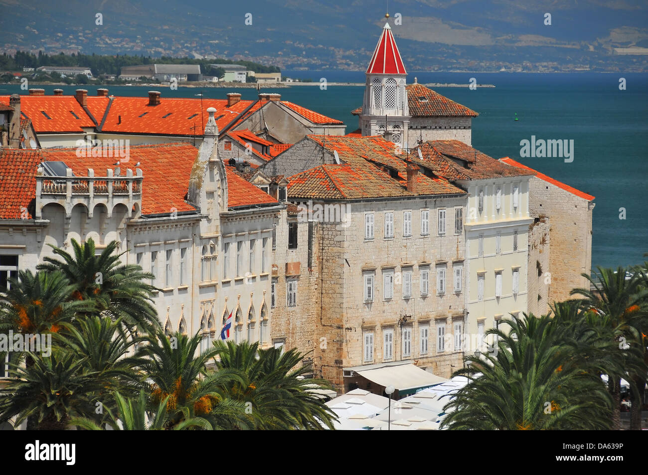 Historic buildings on the sea front of the old medieval town of Trogir ...