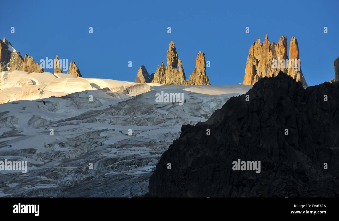 Dawn rises on Les Periades needles in the french alps above chamonix ...