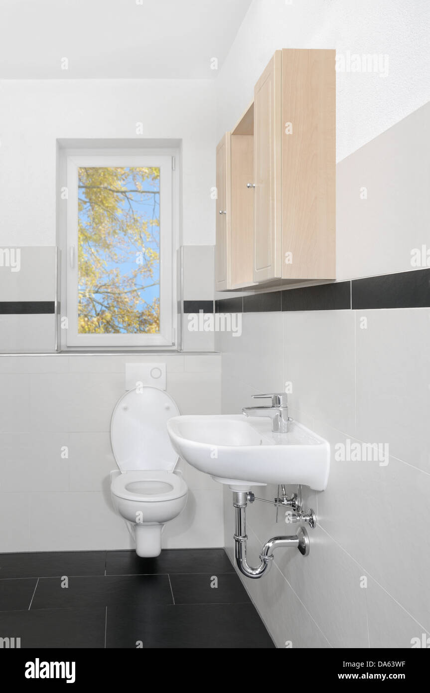 Bathroom with toilet and window Stock Photo - Alamy