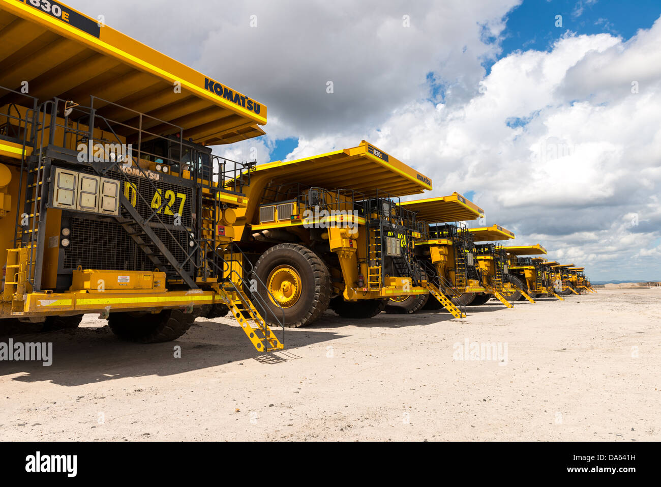 dump trucks lined up idle Stock Photo - Alamy
