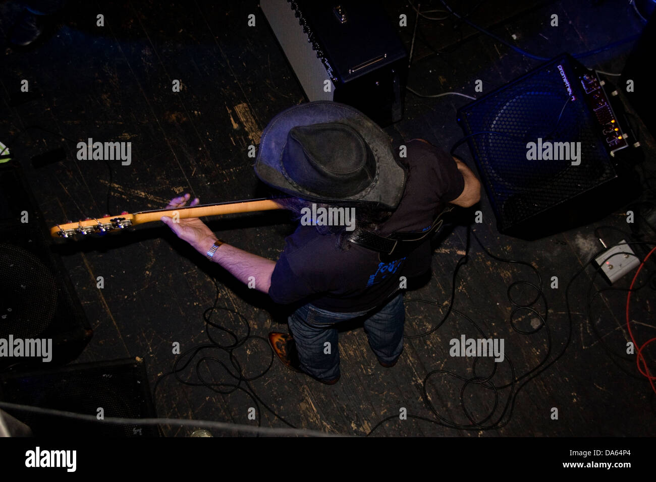 Overhead view of Terry Duggan playing Bass during the live performance ...