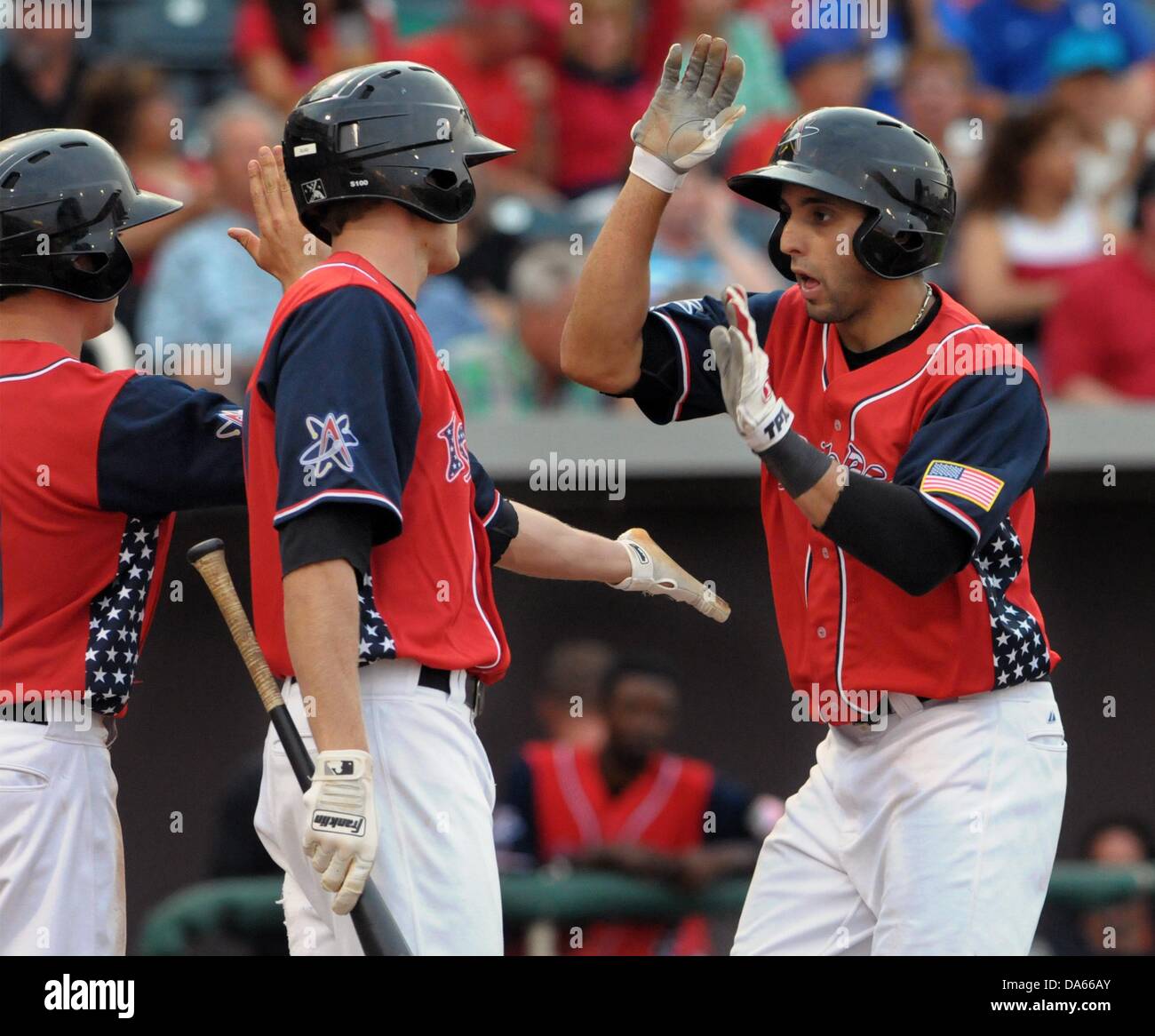 July 4, 2013 - U.S. - Greg Sorber -- The Isotopes Alex Castellanos, right, high fives Matt Angle ...