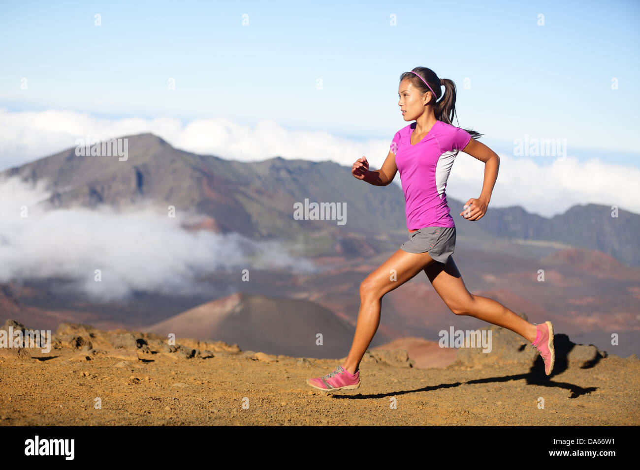 Female running athlete. Woman trail runner sprinting for success goals ...