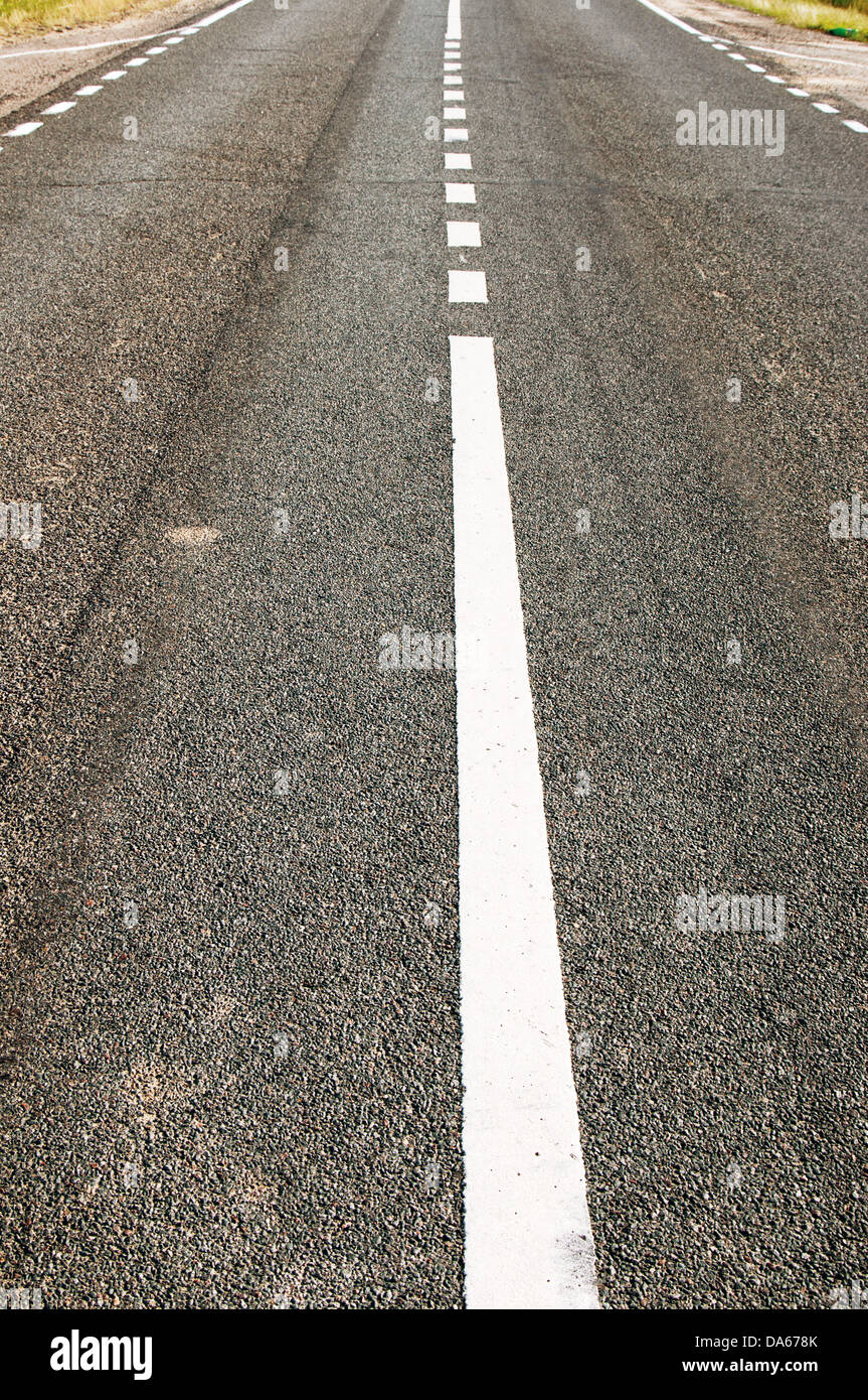 Middle of the asphalt road with marking Stock Photo - Alamy