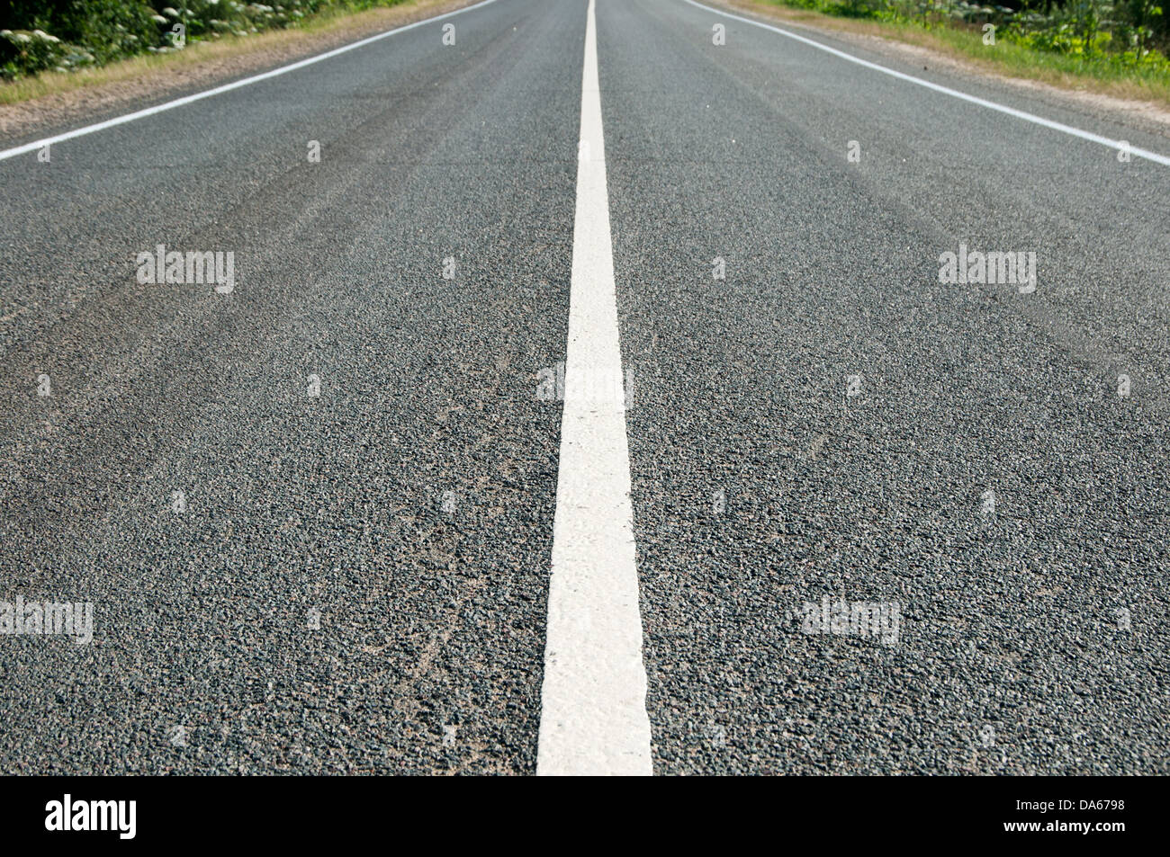 Middle of the asphalt road with marking Stock Photo - Alamy