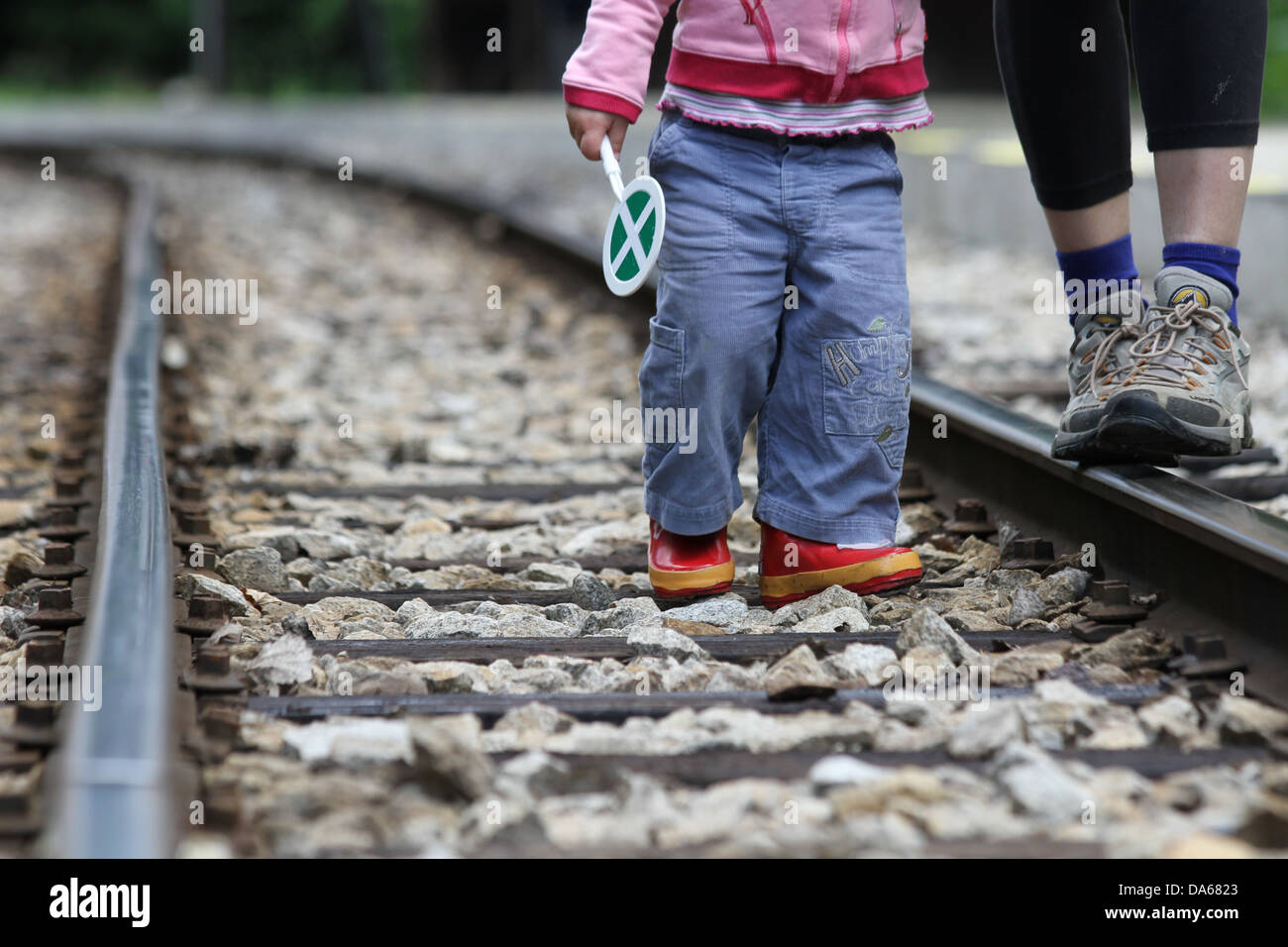 child on the rail Stock Photo - Alamy