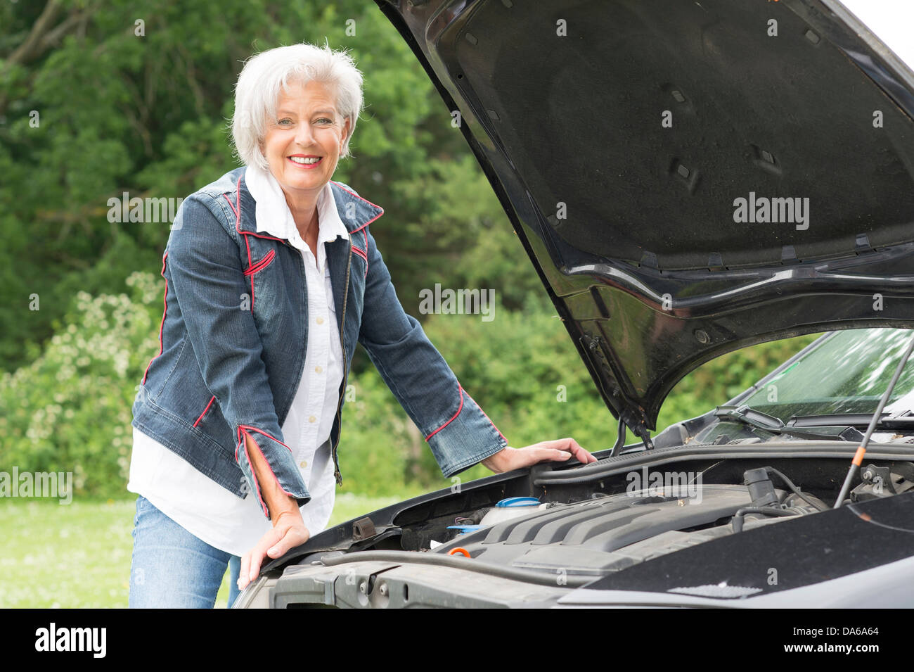 Person standing behind vehicle hi-res stock photography and images - Alamy