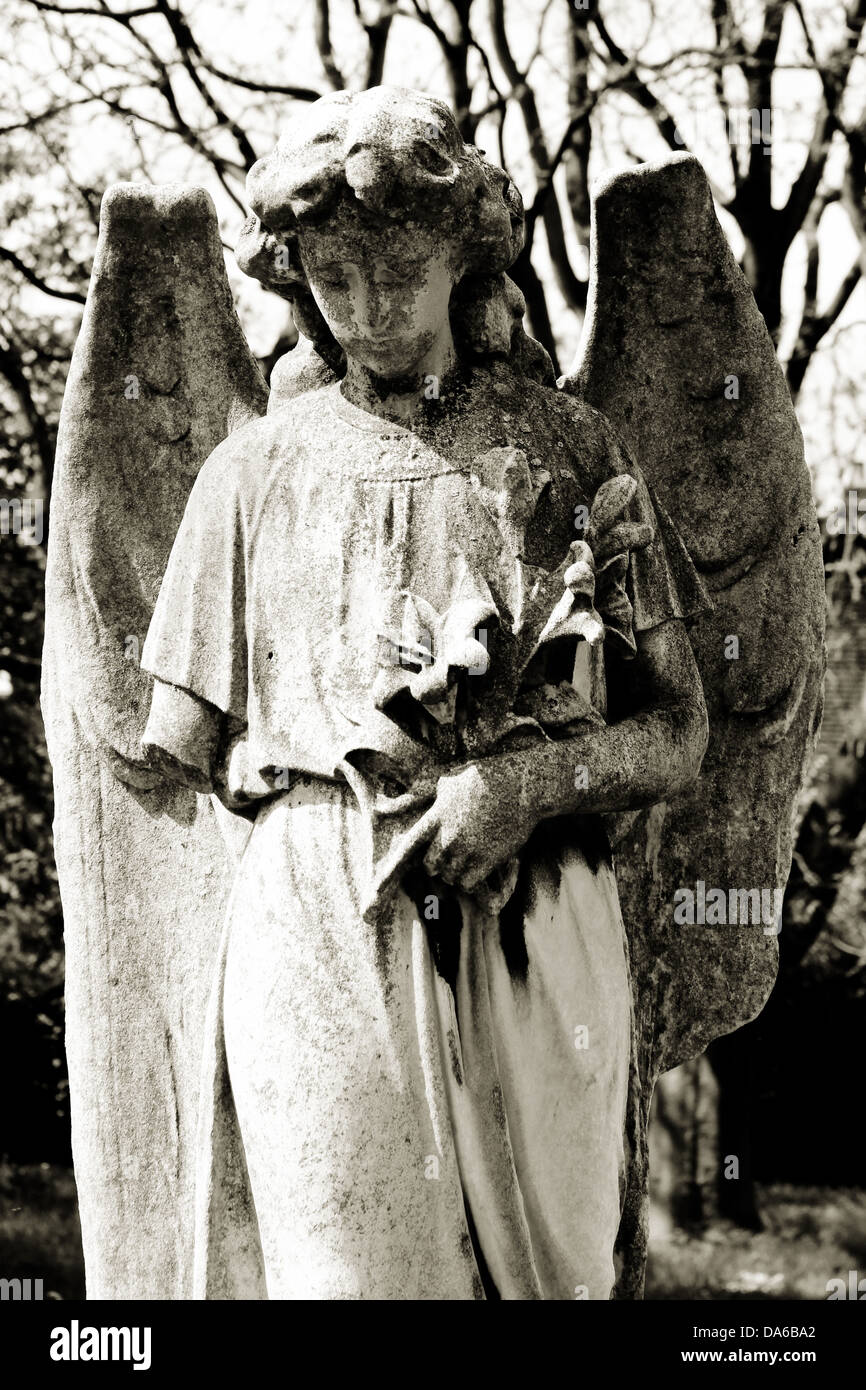 Angel with flowers Stock Photo - Alamy