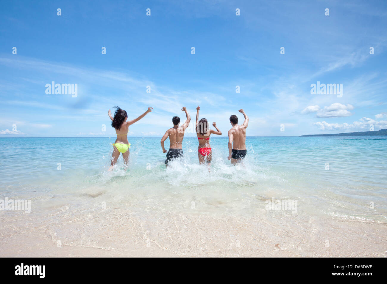 Friends playing on the beach Stock Photo - Alamy